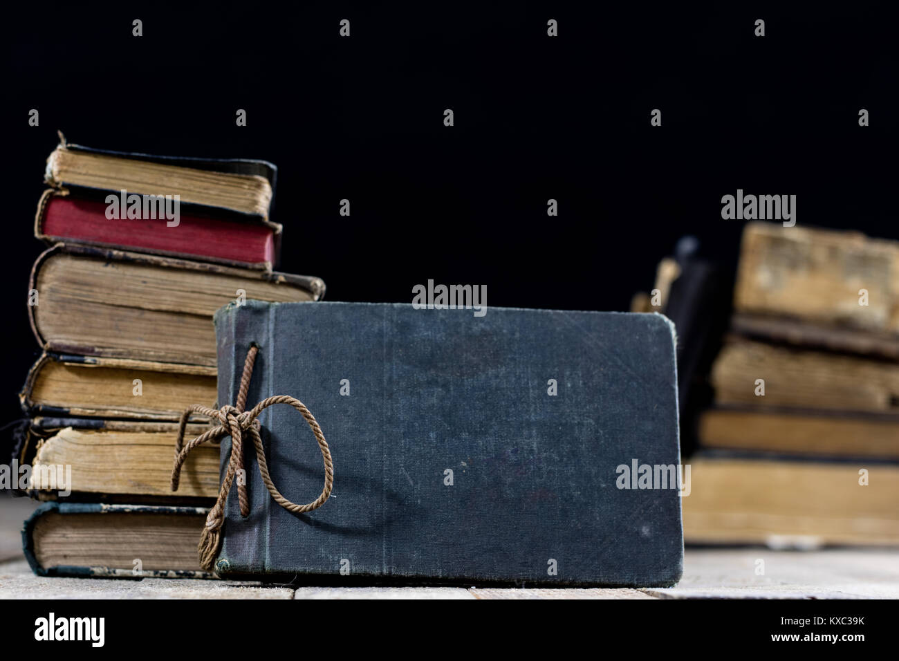 Old destroyed books on a wooden table. Reading room library with very ...