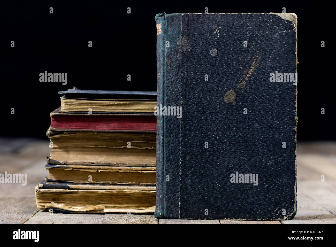 Old destroyed books on a wooden table. Reading room library with very ...
