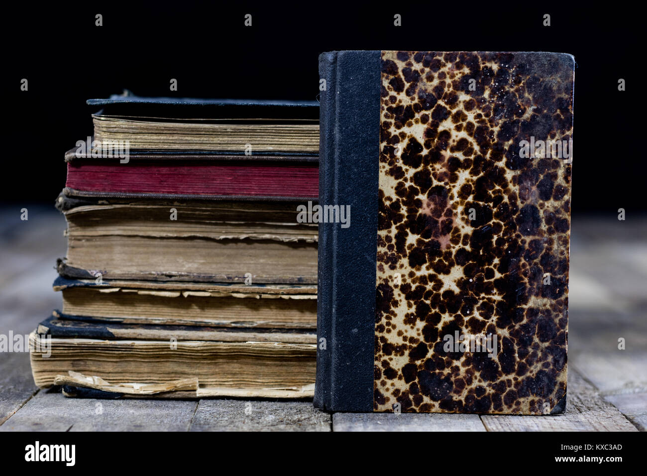 Old destroyed books on a wooden table. Reading room library with very ...