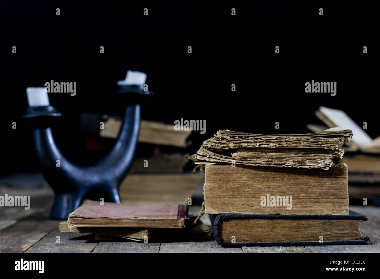 Old destroyed books on a wooden table. Reading room library with very ...