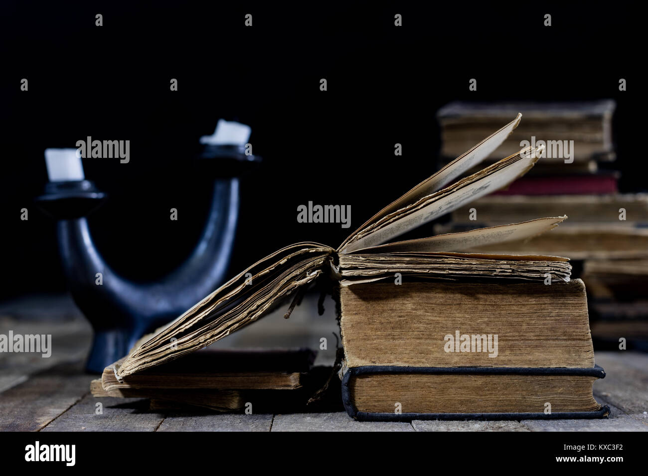 Old destroyed books on a wooden table. Reading room library with very ...