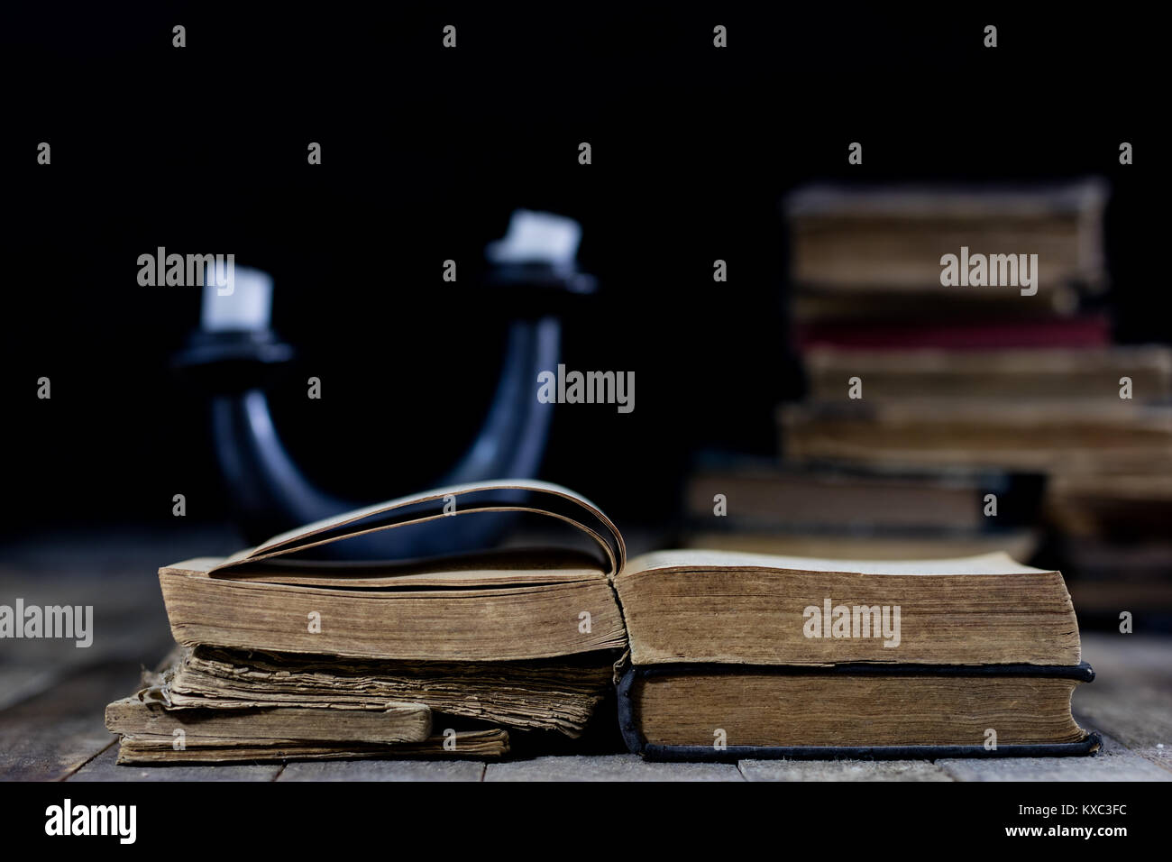Old destroyed books on a wooden table. Reading room library with very ...