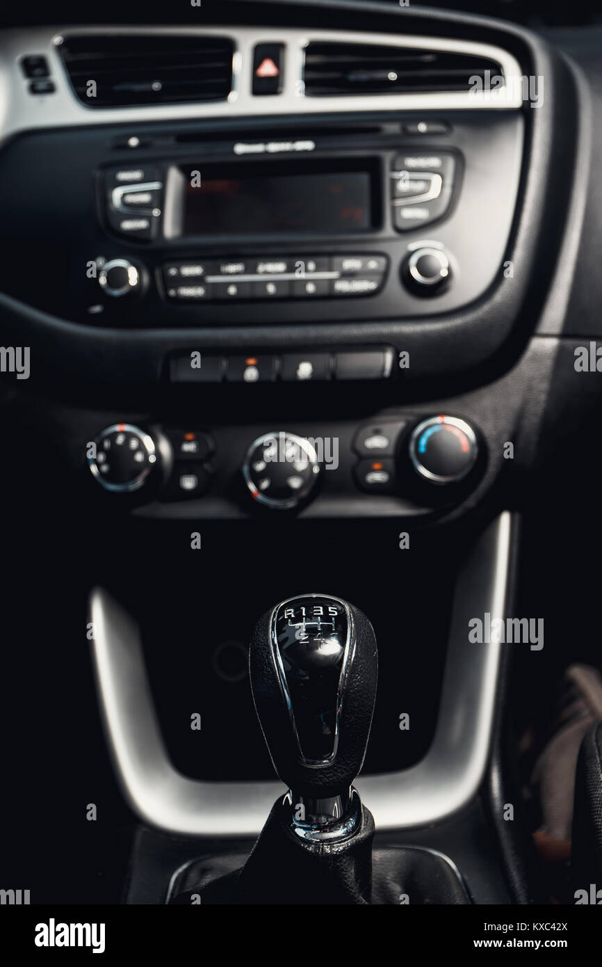 close up of gear shift in the car and central console in the background ...