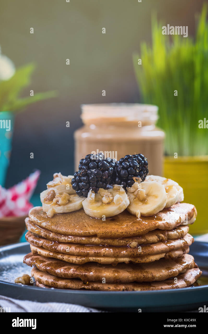 Pancakes served on spring themed table Stock Photo - Alamy