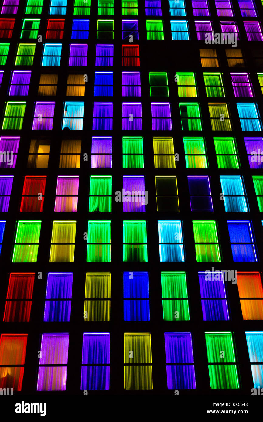 Colored windows texture. Windows illuminated by neon lights background ...