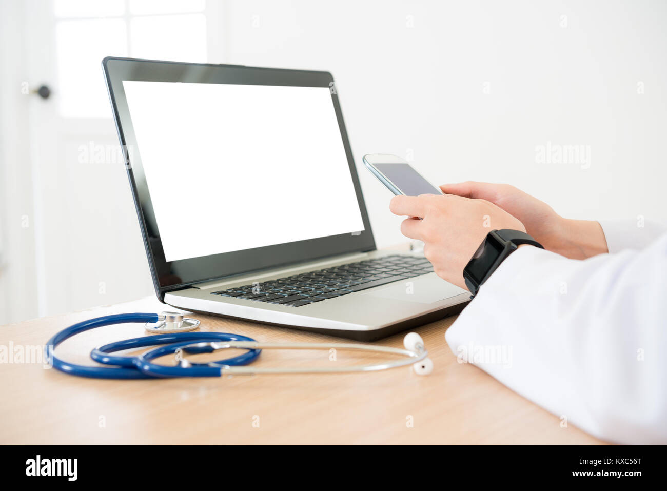 closeup photo of doctor using mobile smartphone when she working with ...