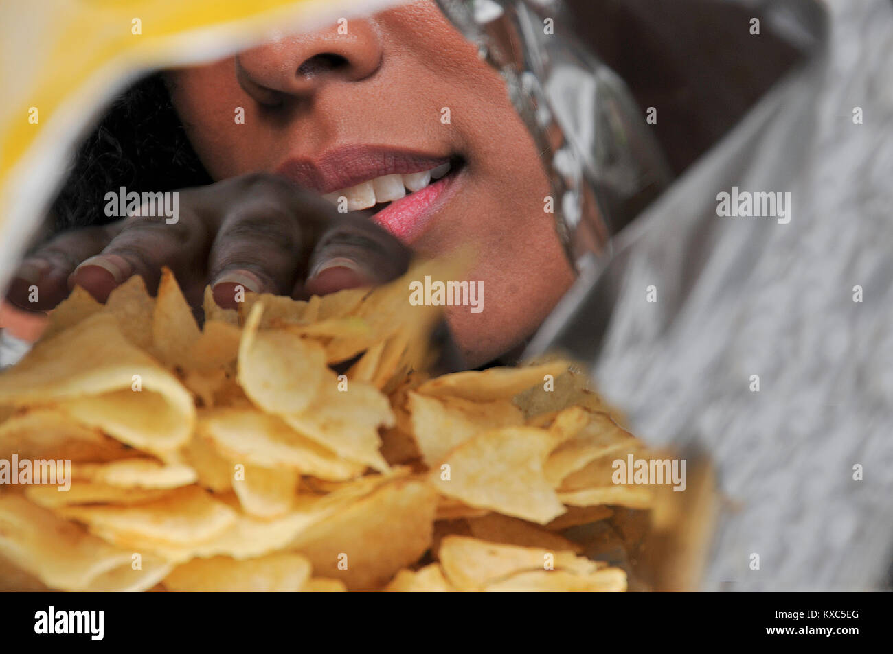 Hand in bag of chips hi-res stock photography and images - Alamy