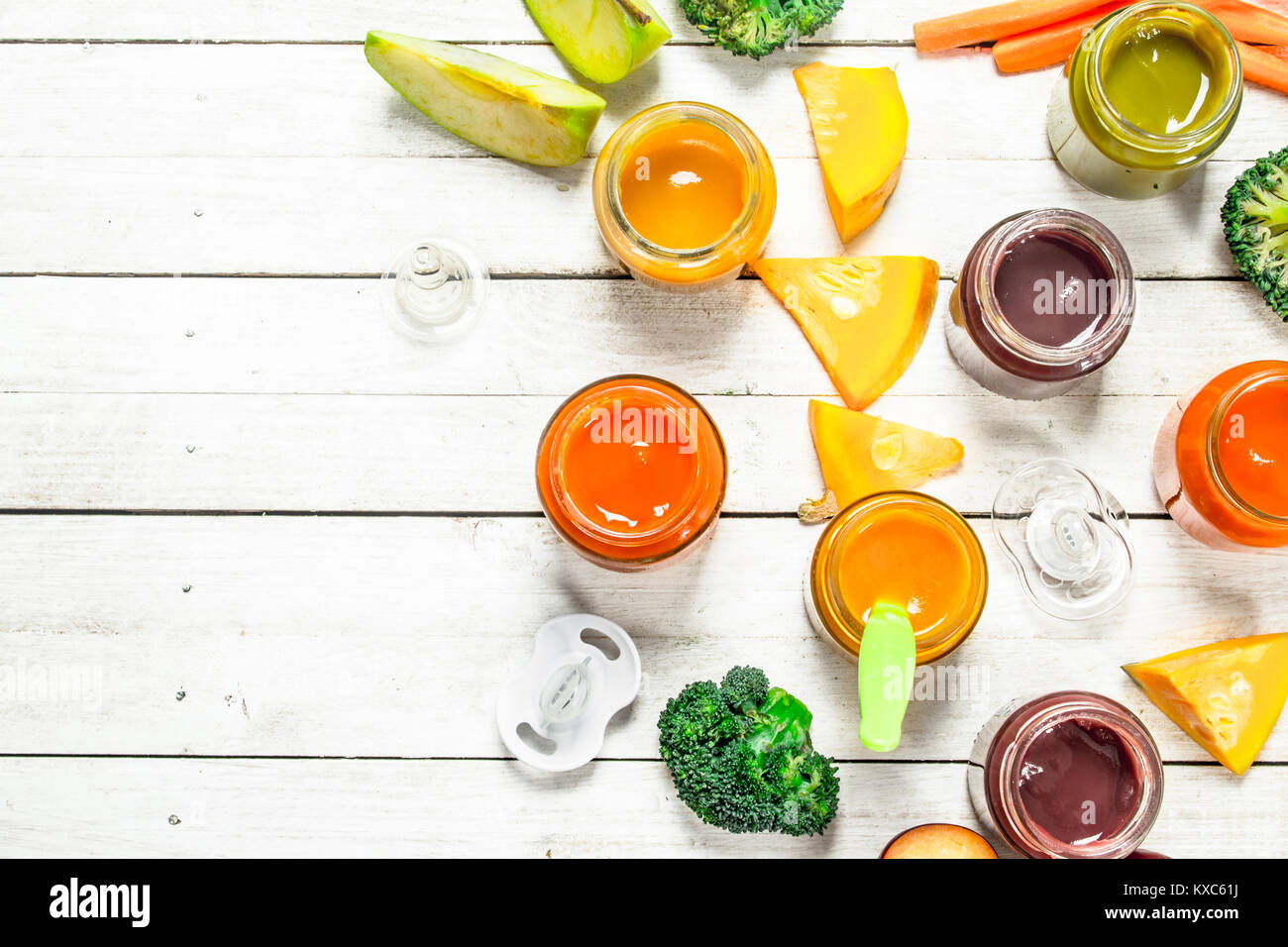 Baby food. Various baby purees from fresh vegetables and fruits. On a ...