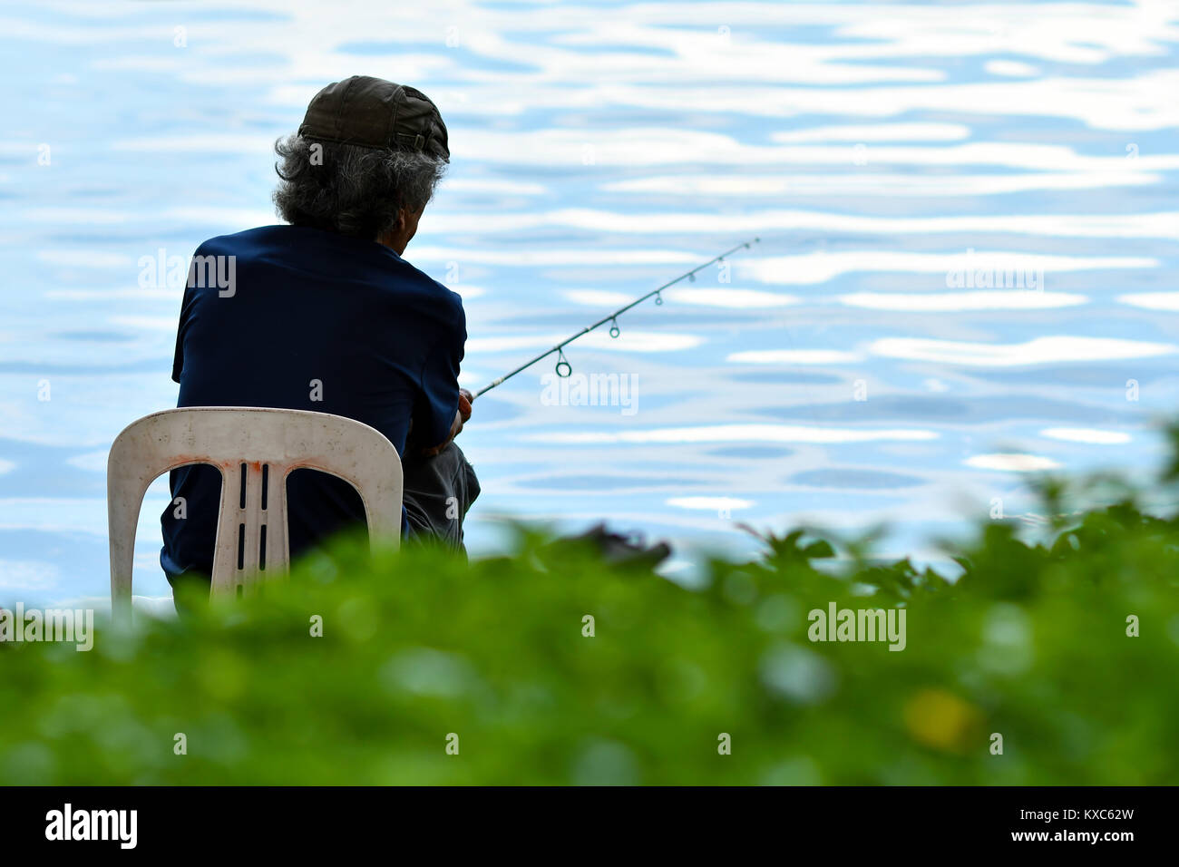 Old man fishing hi-res stock photography and images - Alamy
