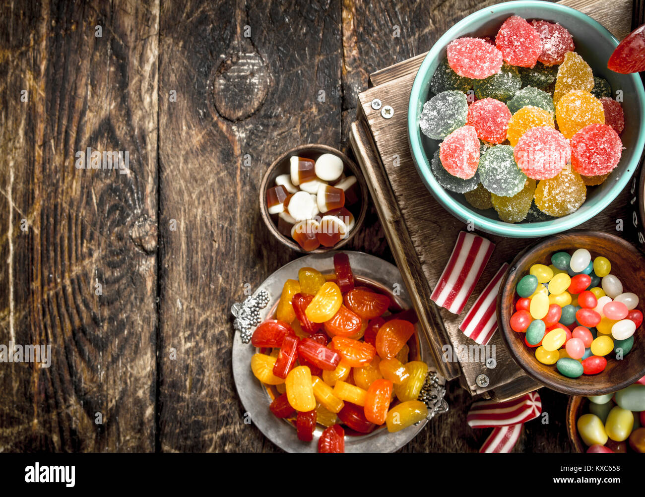 Different sweet candy, jelly, marshmallows and candied fruits. On a ...