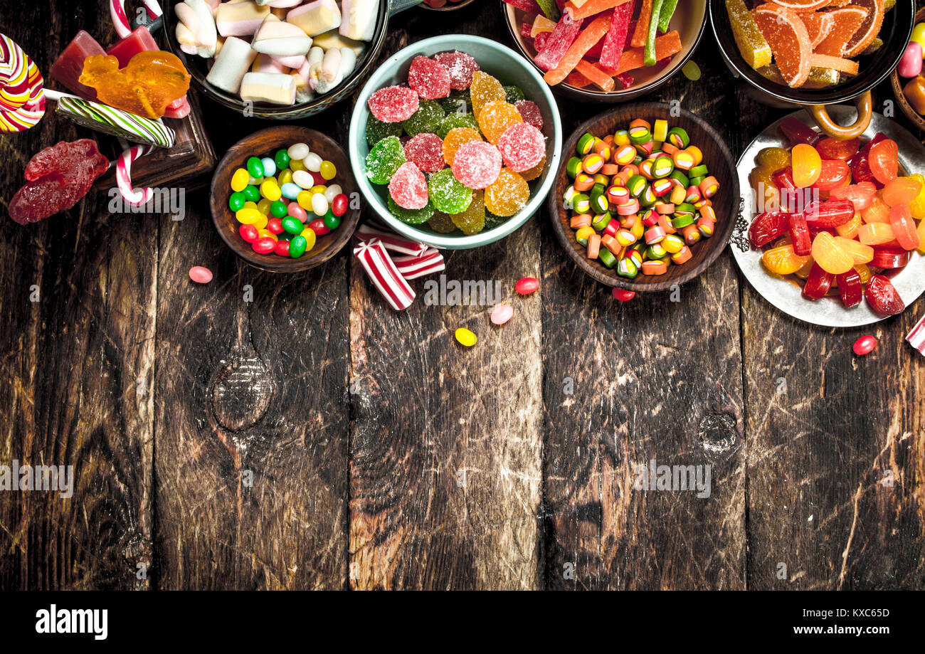 Different sweet candy, jelly, marshmallows and candied fruits. On a ...