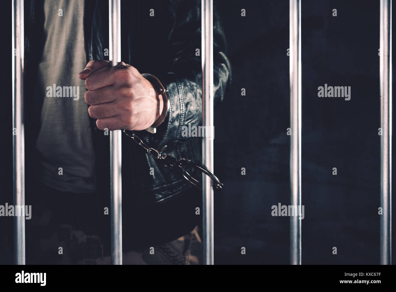 Man behind bars hi-res stock photography and images - Alamy