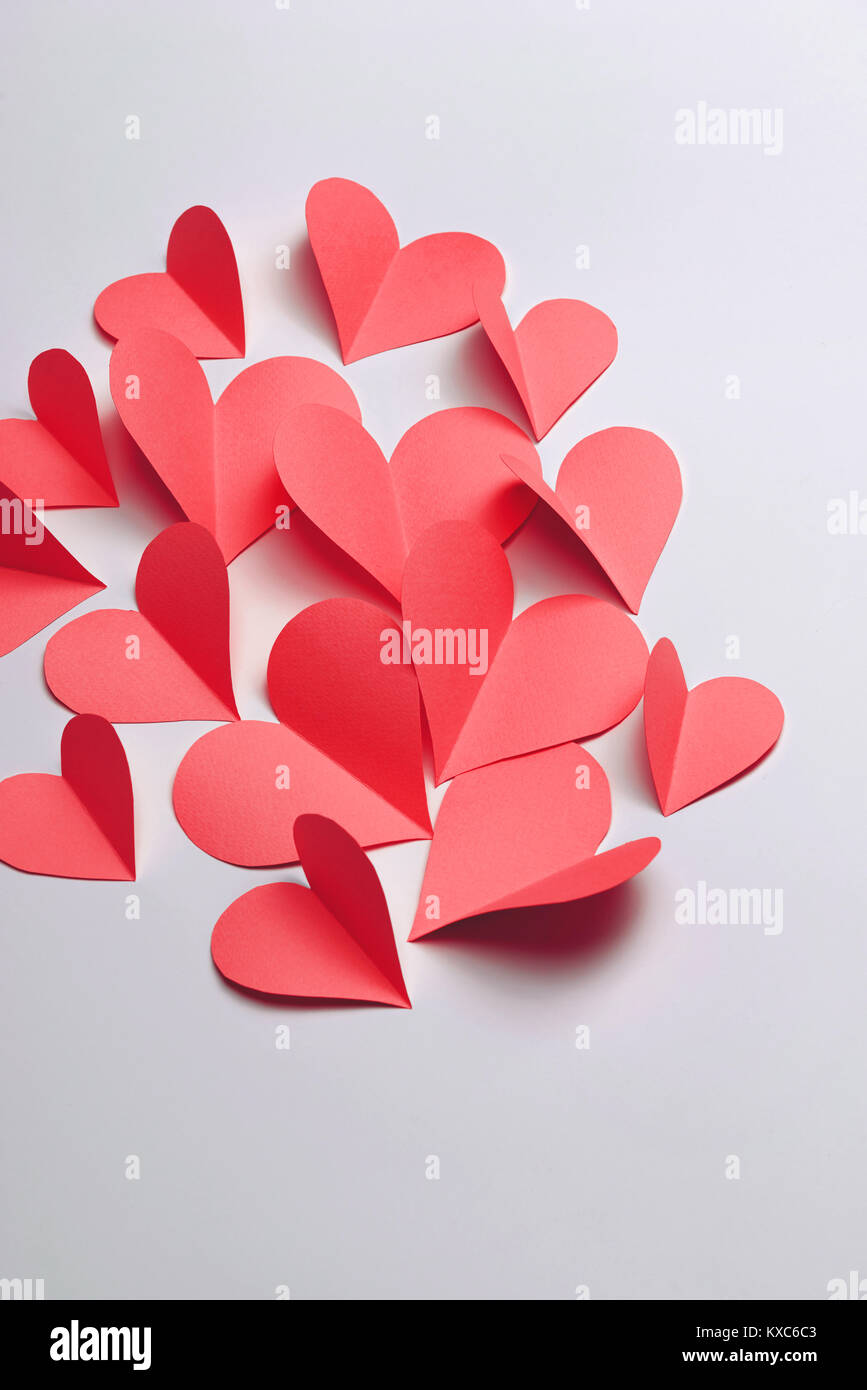 Beautiful pink paper hearts on white paper background Stock Photo - Alamy
