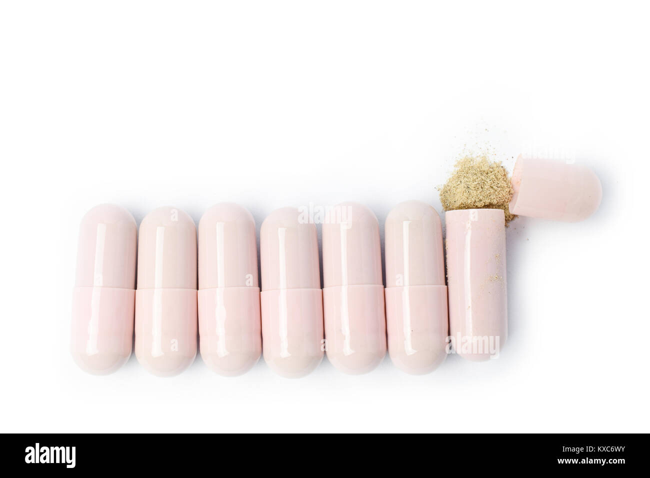 herbal medicine powder capsule on a white background Stock Photo - Alamy