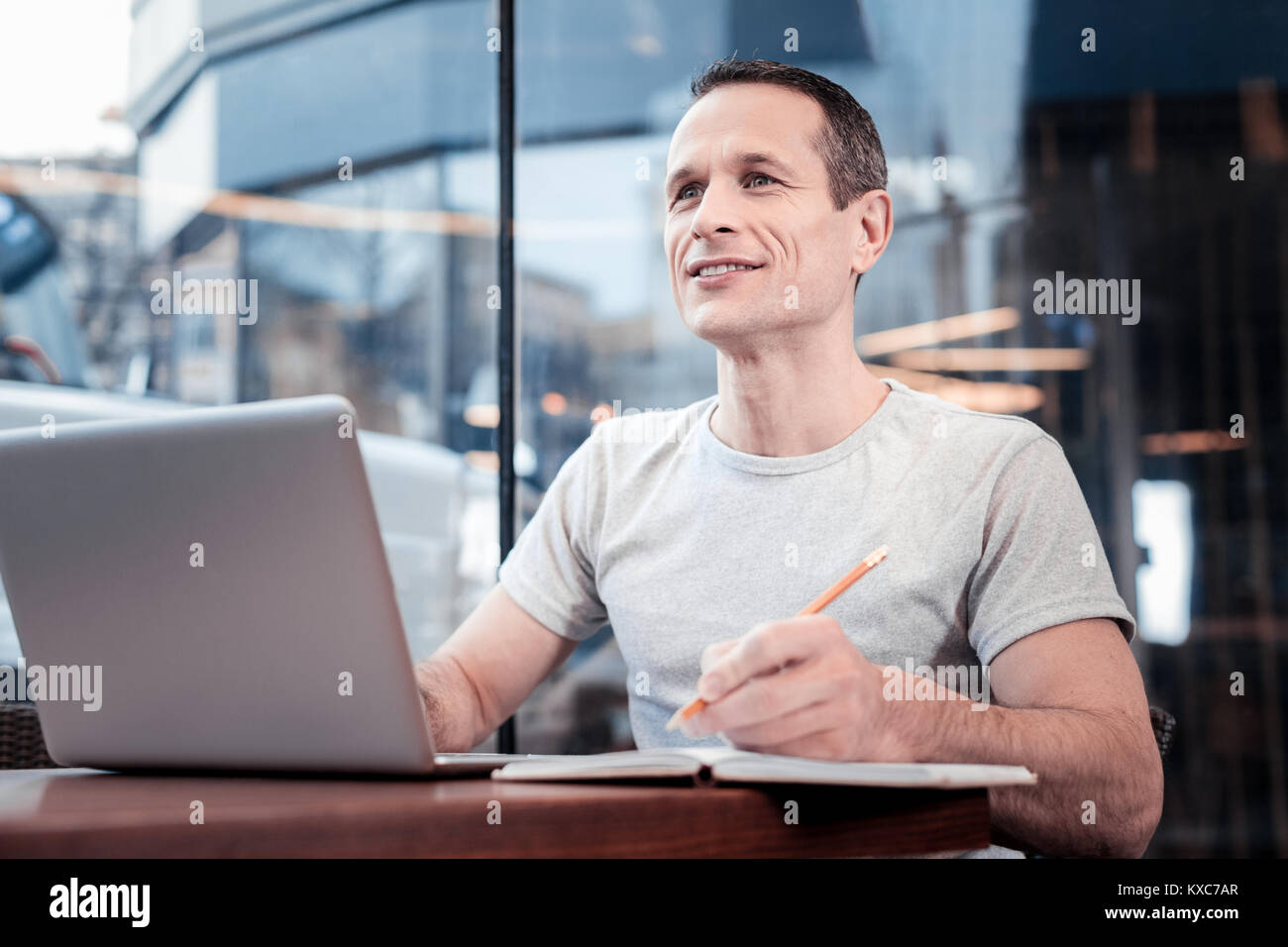 Thoughtful male person creating new plan Stock Photo - Alamy