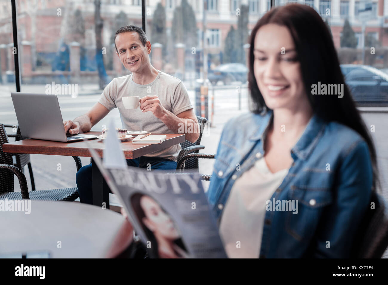 Positive delighted man flirting to pretty girl Stock Photo - Alamy