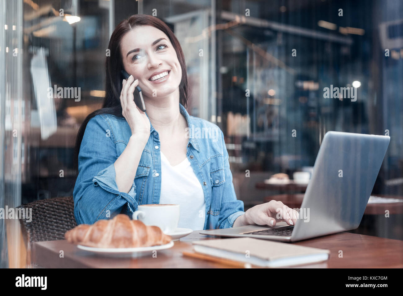 Charming woman having pleasant conversation Stock Photo - Alamy