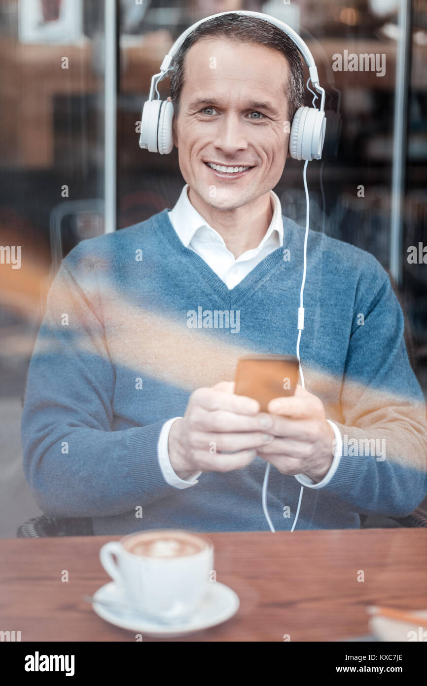 Positive delighted male person being deep in thoughts Stock Photo - Alamy
