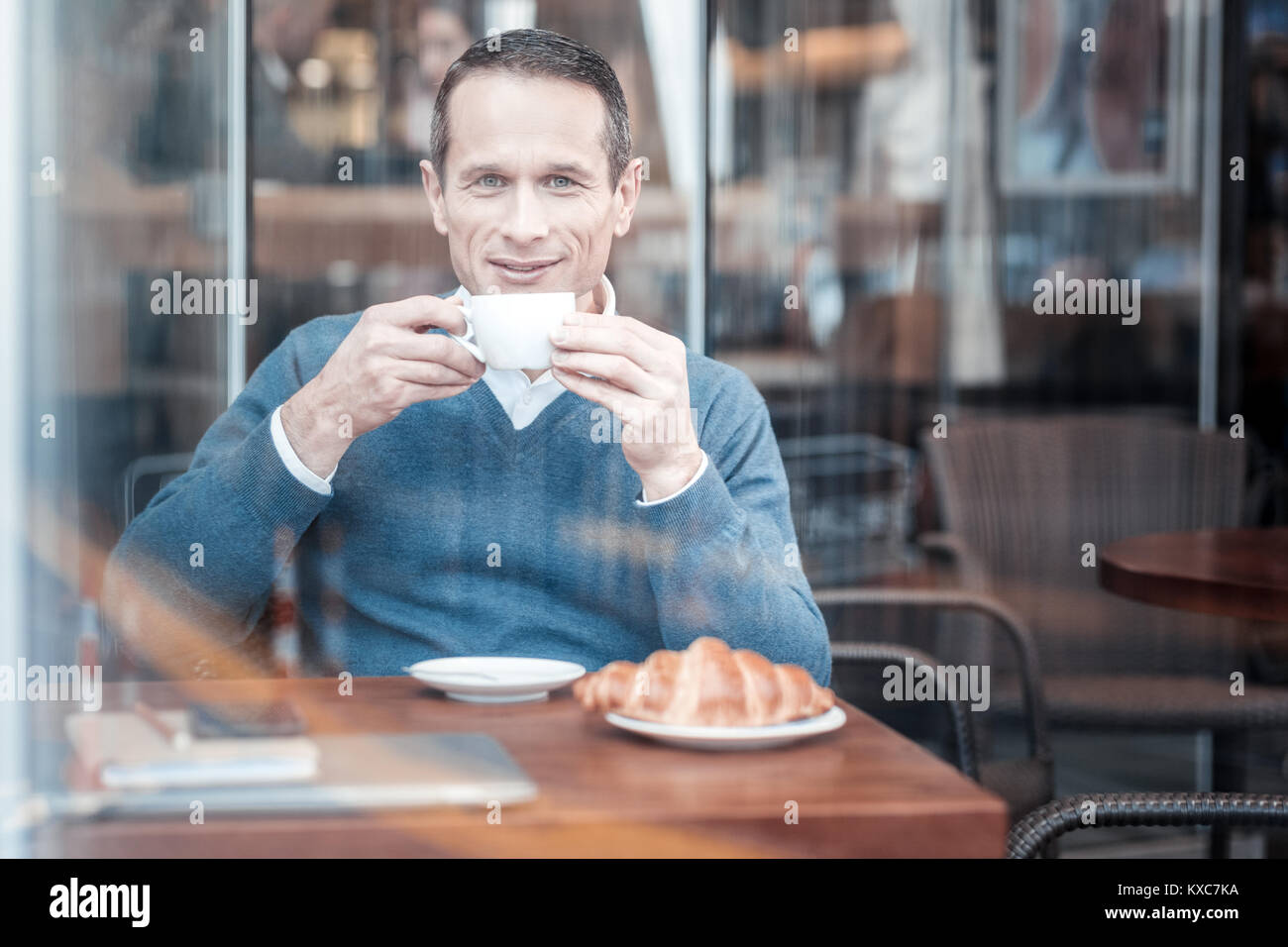 Handsome man drinking morning coffee Stock Photo - Alamy
