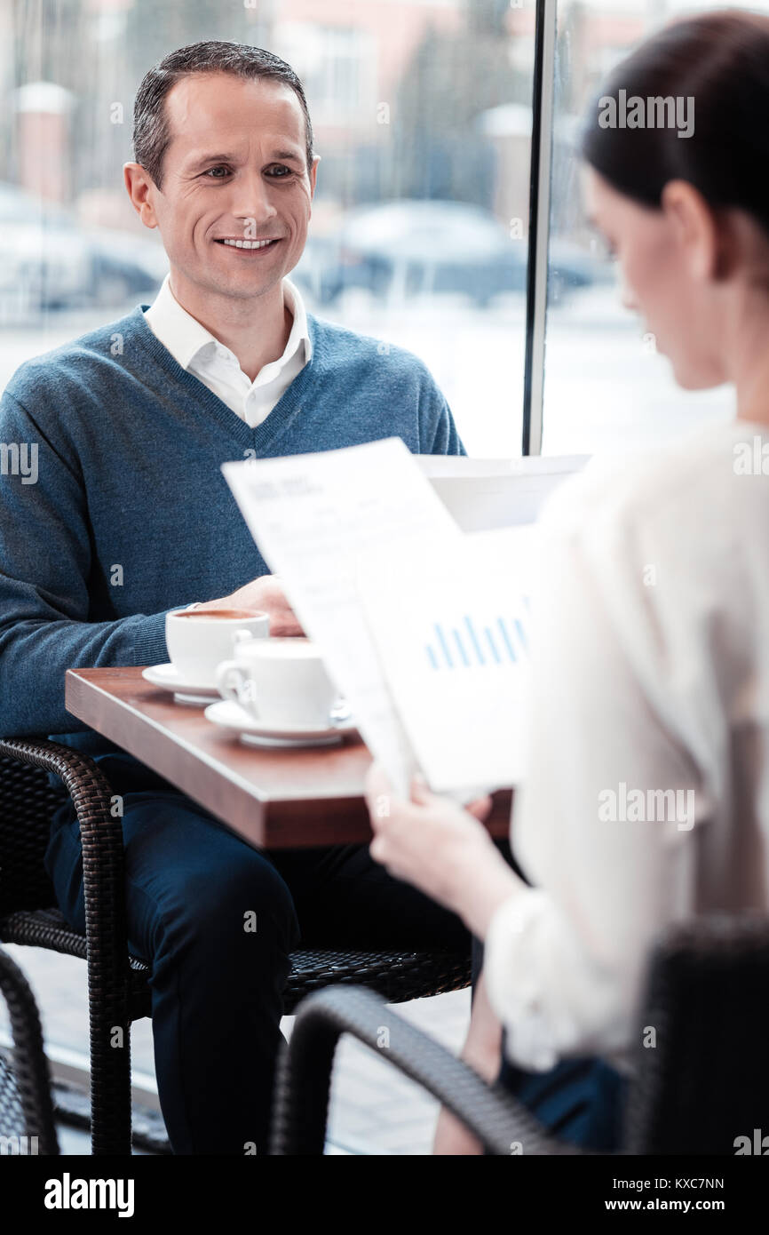 Attentive woman checking materials before printing Stock Photo - Alamy