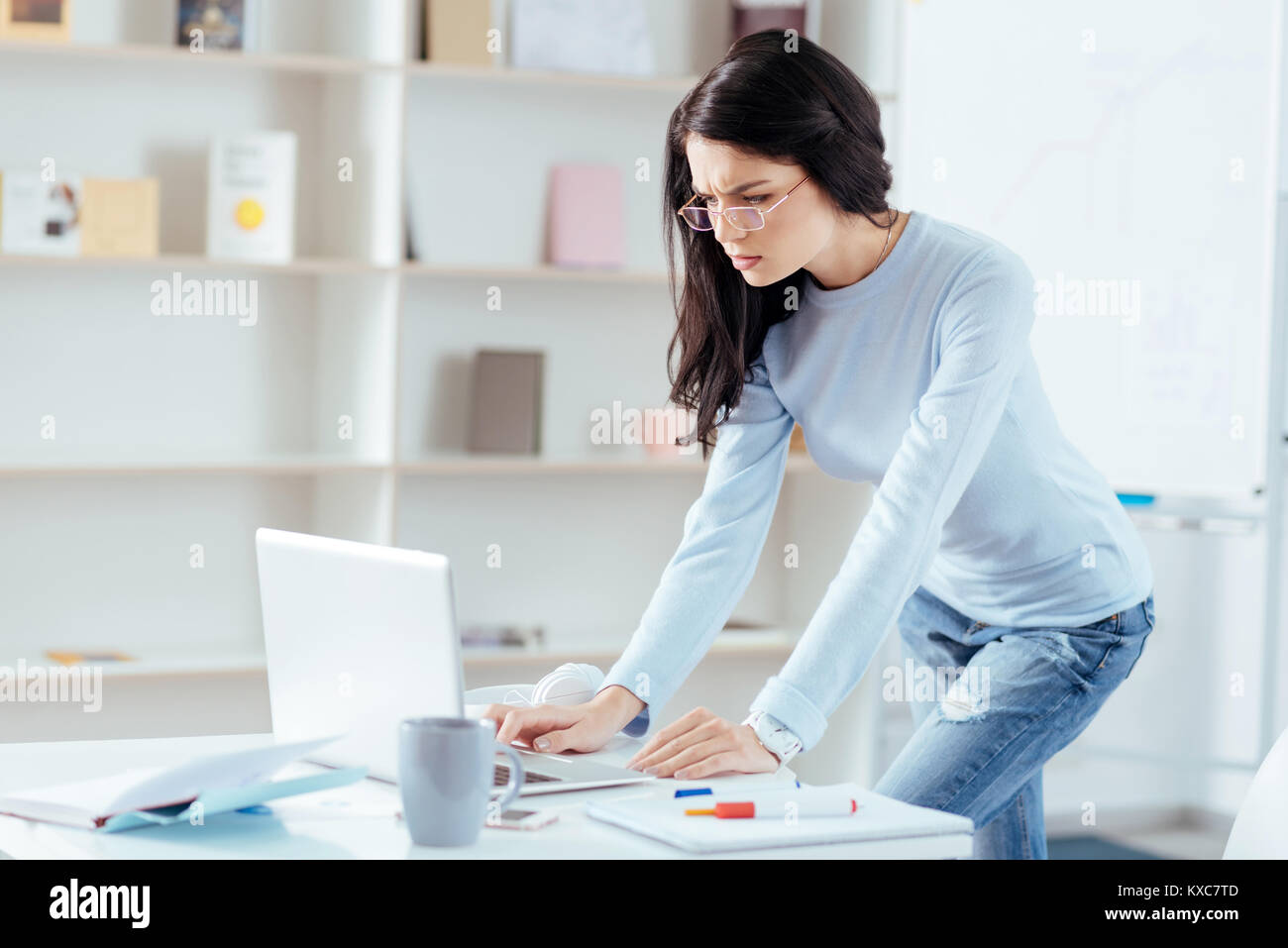 Beautiful focused woman doing her work Stock Photo - Alamy