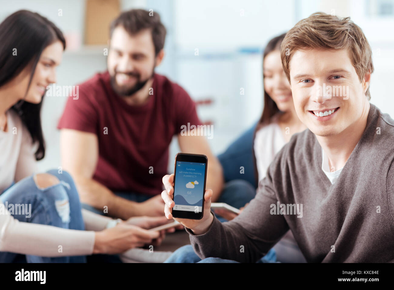 Cheerful four friends relaxing together Stock Photo - Alamy