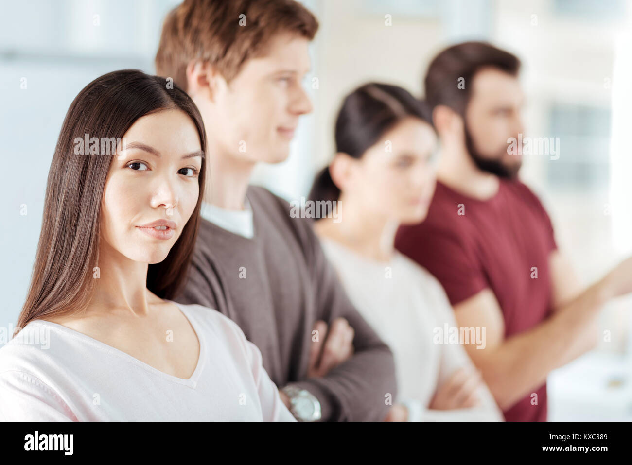 Young beautiful woman acting in team Stock Photo - Alamy