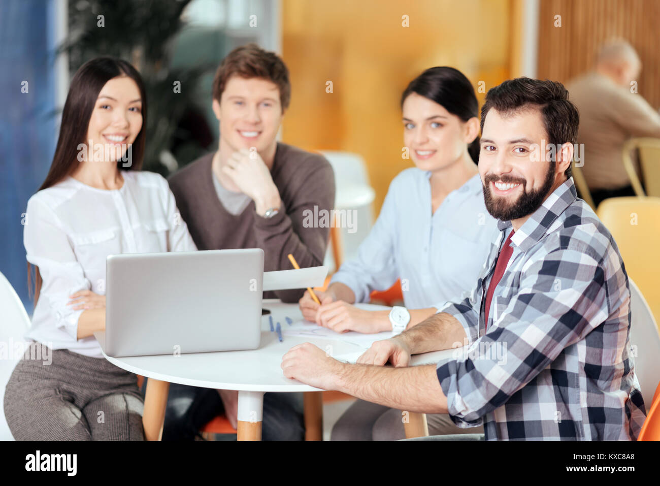 Skillful handsome man planning budget Stock Photo - Alamy