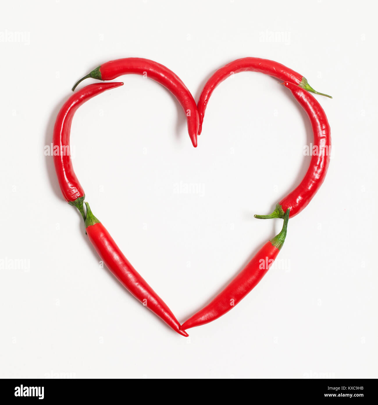 Red chili peppers arranged to make a heart shape Stock Photo - Alamy