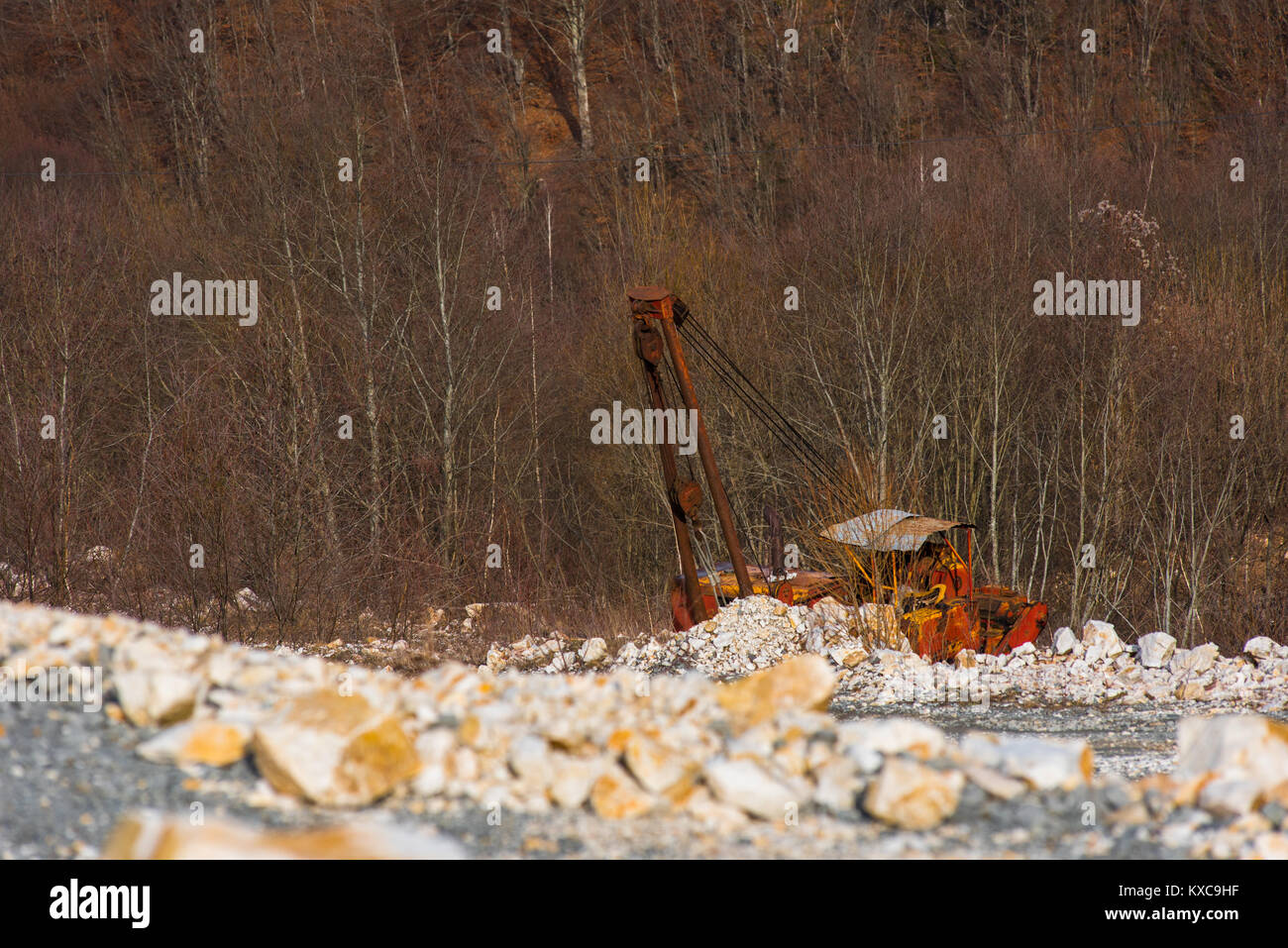 Old broken abandoned rusty excavator in a quarry, mine Stock Photo - Alamy