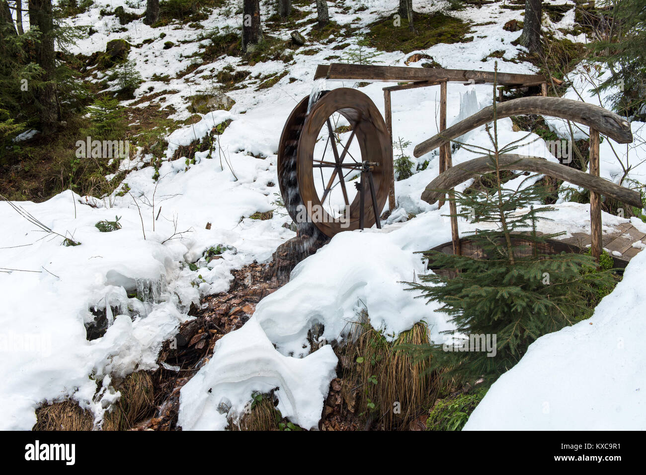 Functional small water mill wheel in the forest at winter Stock Photo ...