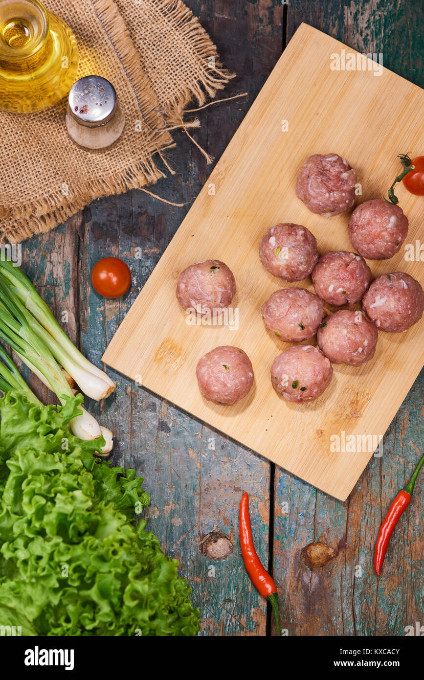 Homemade food. Raw fish ball in the kitchen with vegetables Stock Photo ...