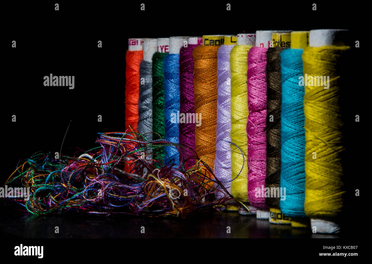 Red and white coloured threads hi-res stock photography and images - Alamy