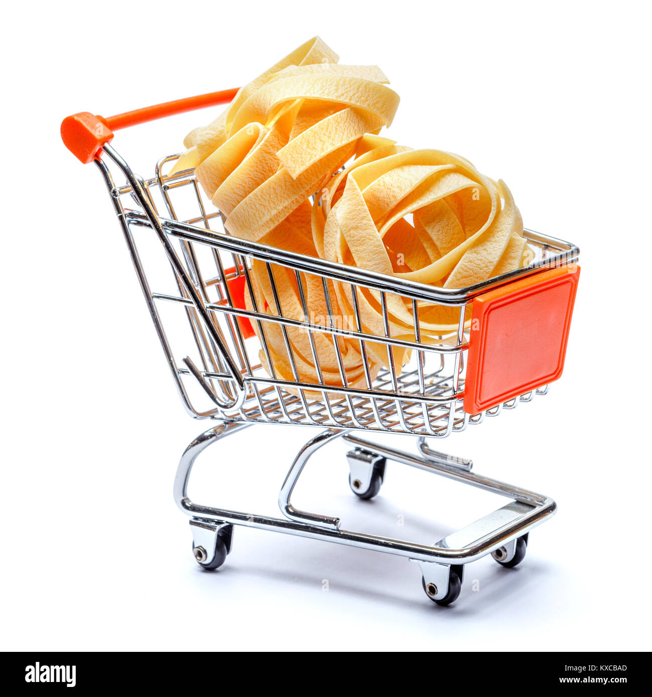 raw fettuccine ribbon pasta in shopping cart on white background Stock ...
