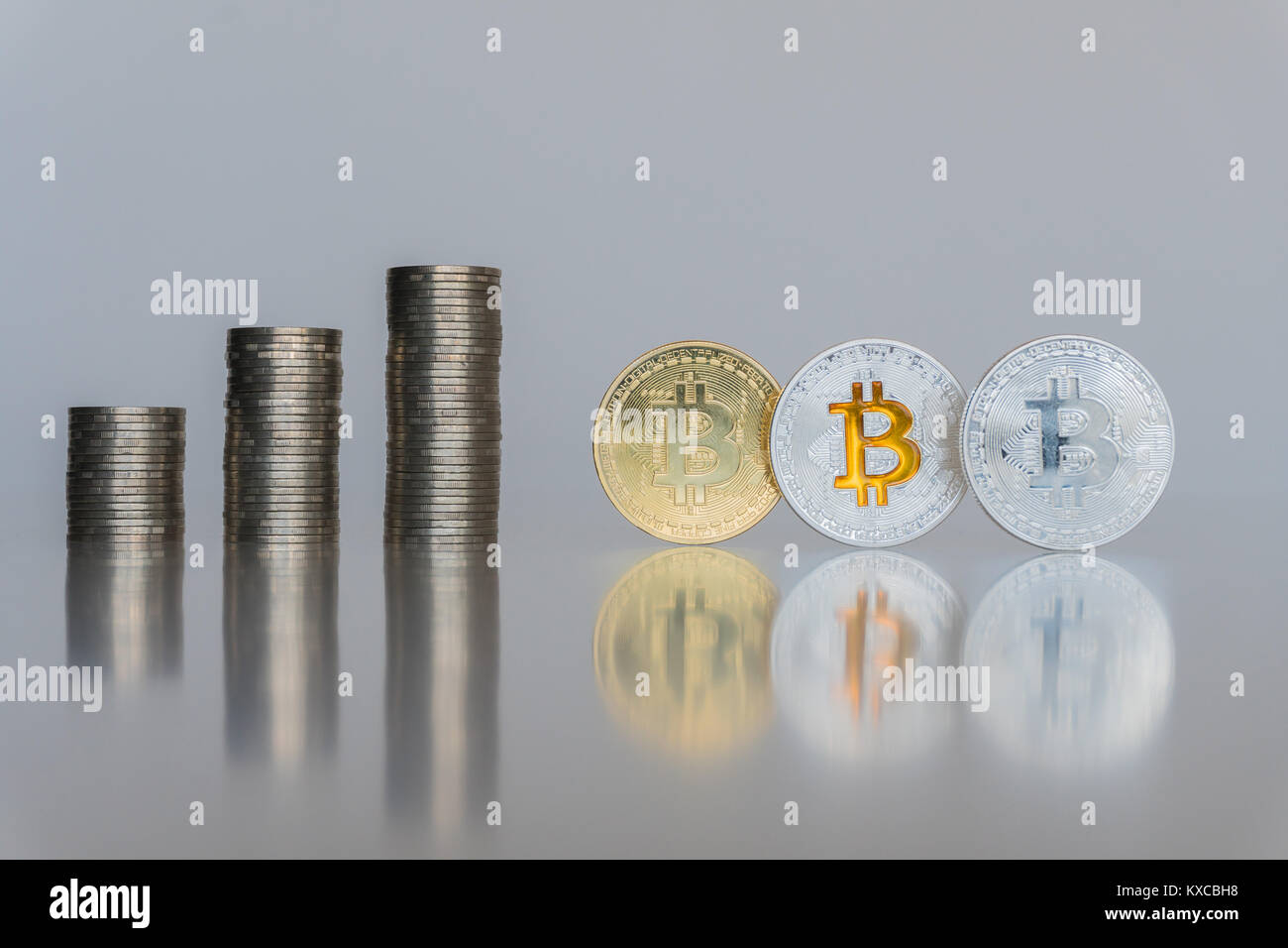 Stacks of silver coins on the table with the Bitcoins. BTC. Internet ...