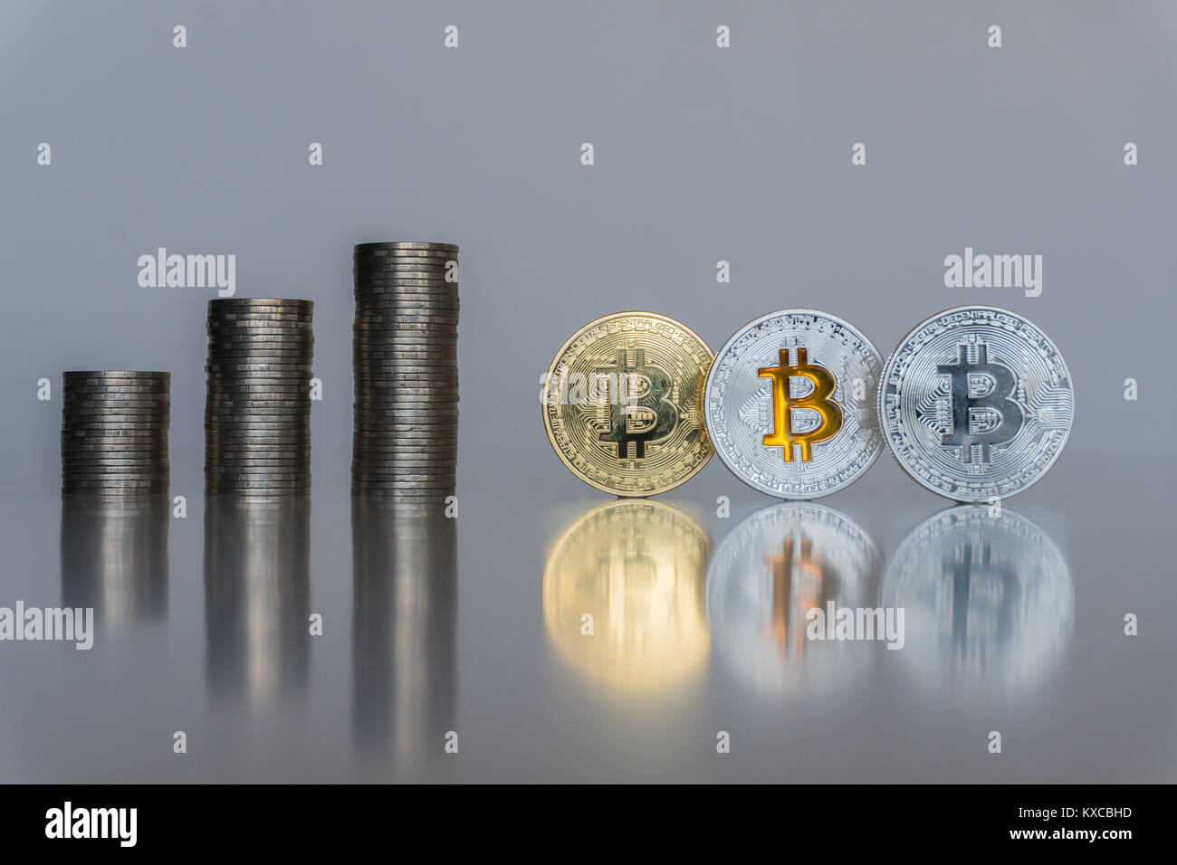 Stacks of silver coins on the table with the Bitcoins. BTC. Internet ...