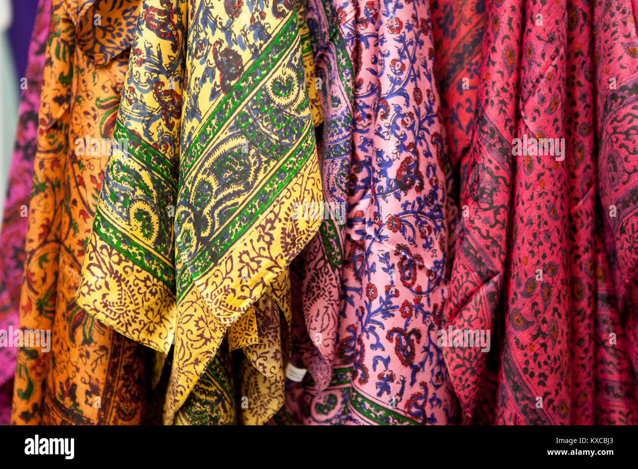 Colourful silk scarf hanging in a line Stock Photo - Alamy