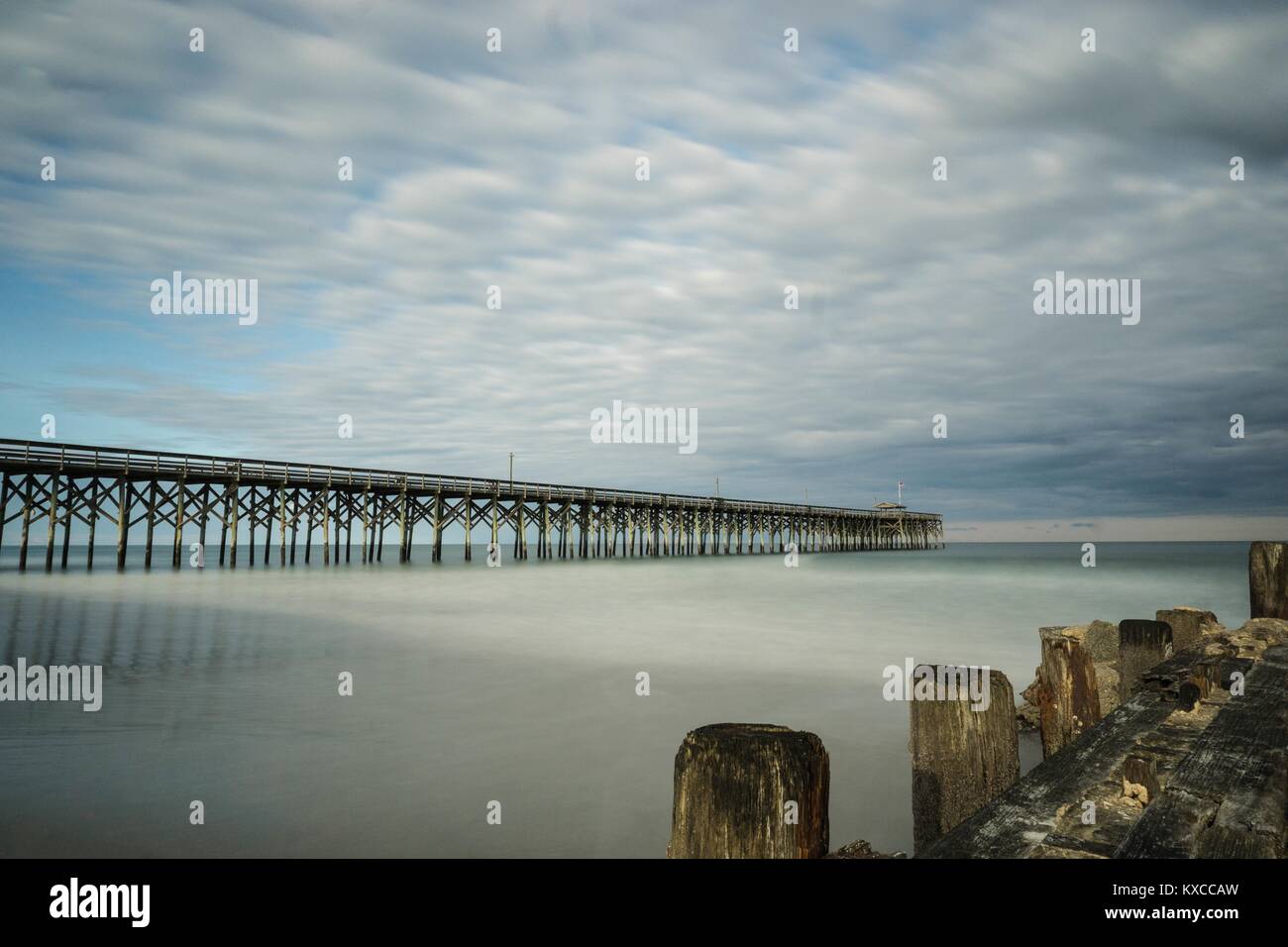 Pawleys Island beach with pier and storm groin Stock Photo - Alamy