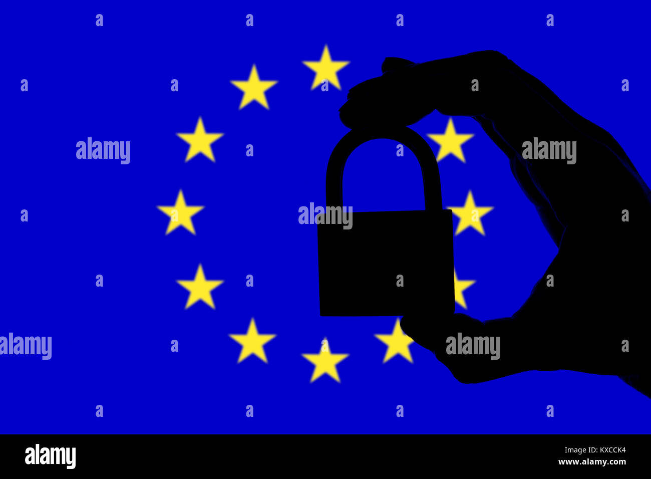 European Union security. Silhouette of hand holding a padlock over ...