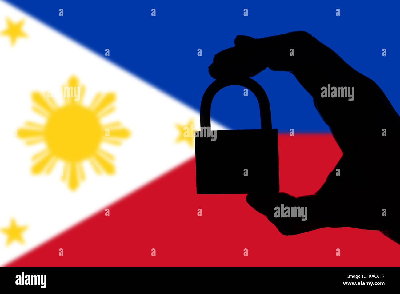 Philippines security. Silhouette of hand holding a padlock over ...