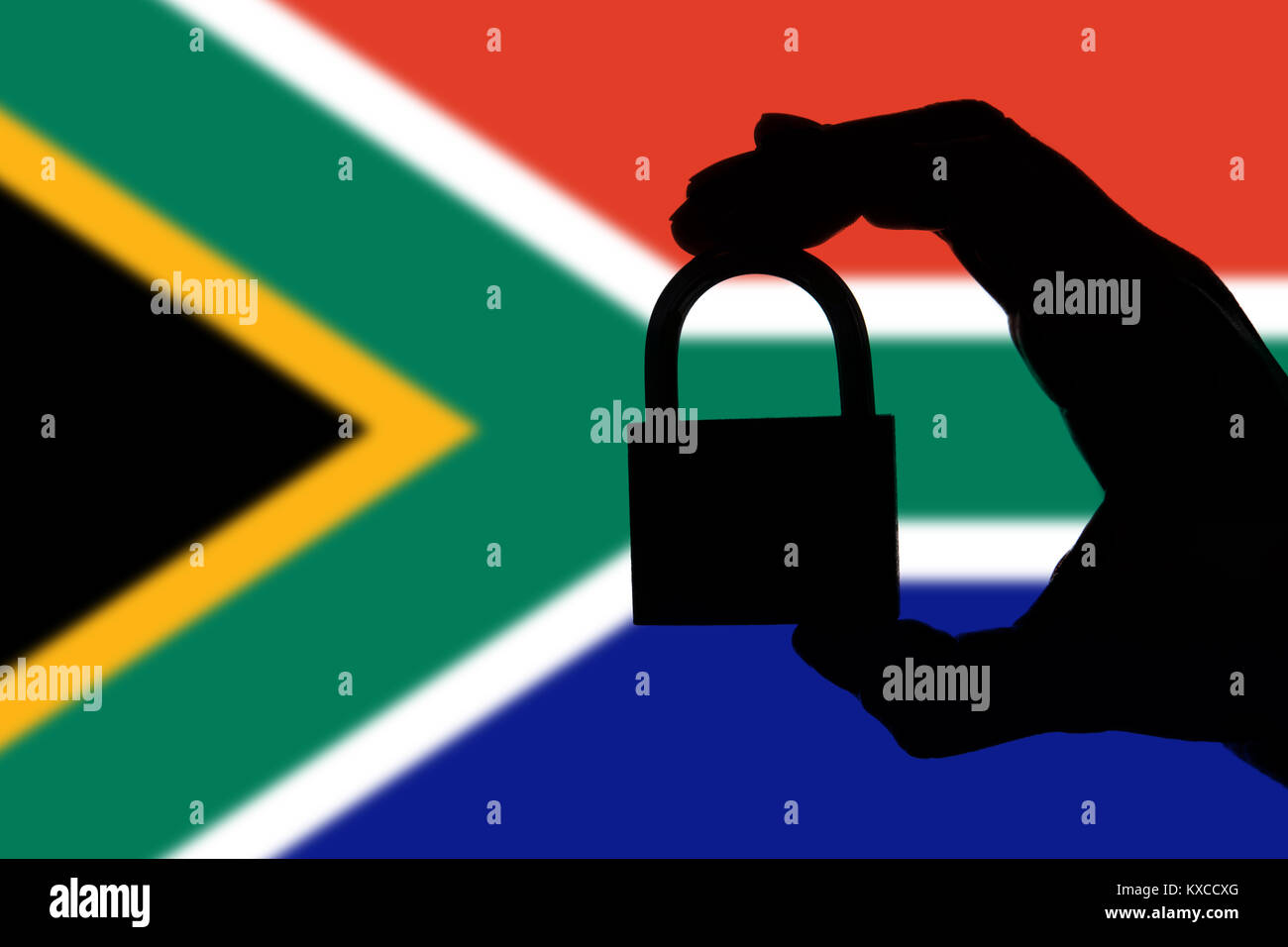 South Africa security. Silhouette of hand holding a padlock over ...