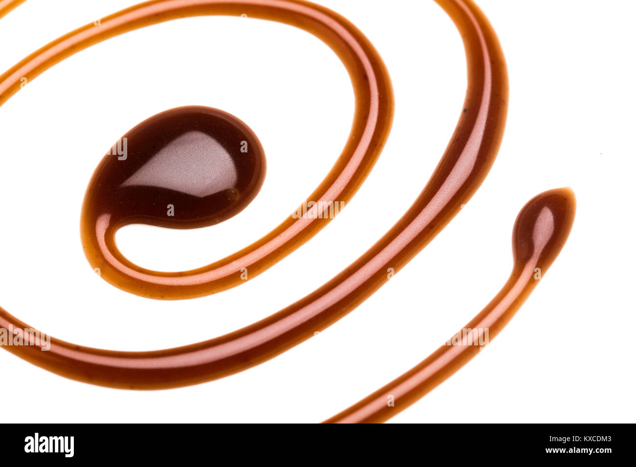 Chocolate caramel sauce swirl on a plain white backround Stock Photo ...