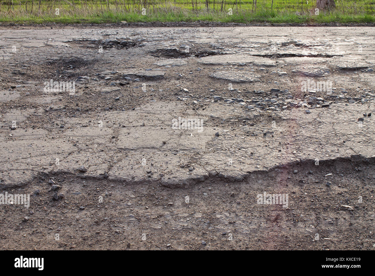pits and potholes on asphalt road. The bad broken road Stock Photo - Alamy