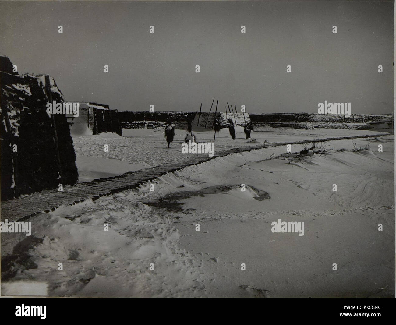 This image shows a snow-covered trench used by Feldjägerbataillon 25 ...