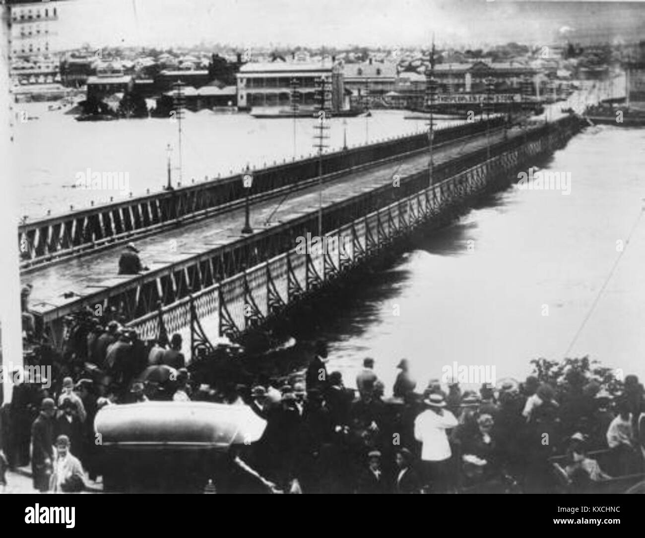 This photograph shows the Victoria Bridge in Brisbane during the ...