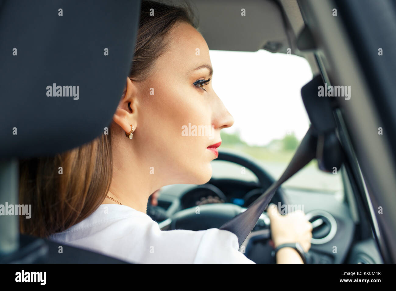 Young woman rent a car for travelling. Business woman sitting in a new ...