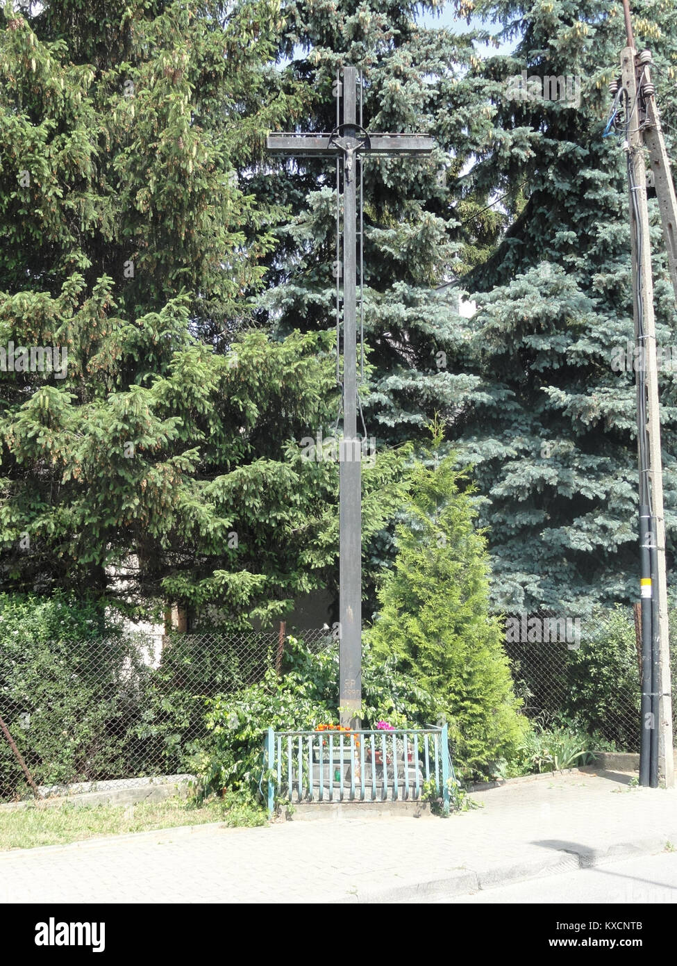 A 2017 photograph of the Pludowska Cross in Warsaw, Poland, documenting ...