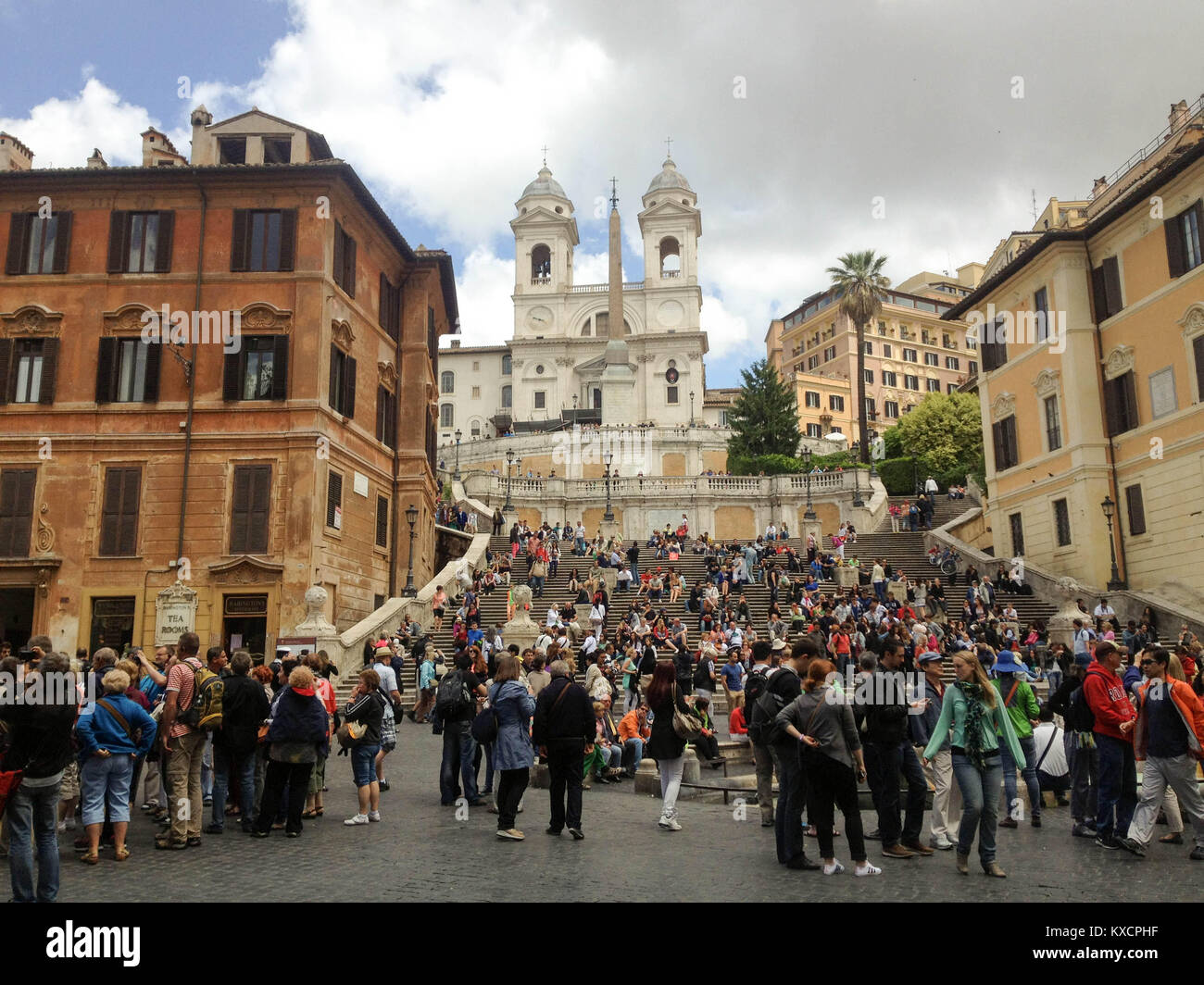 Front view of the Spanish Steps, with many people sitting and walking ...