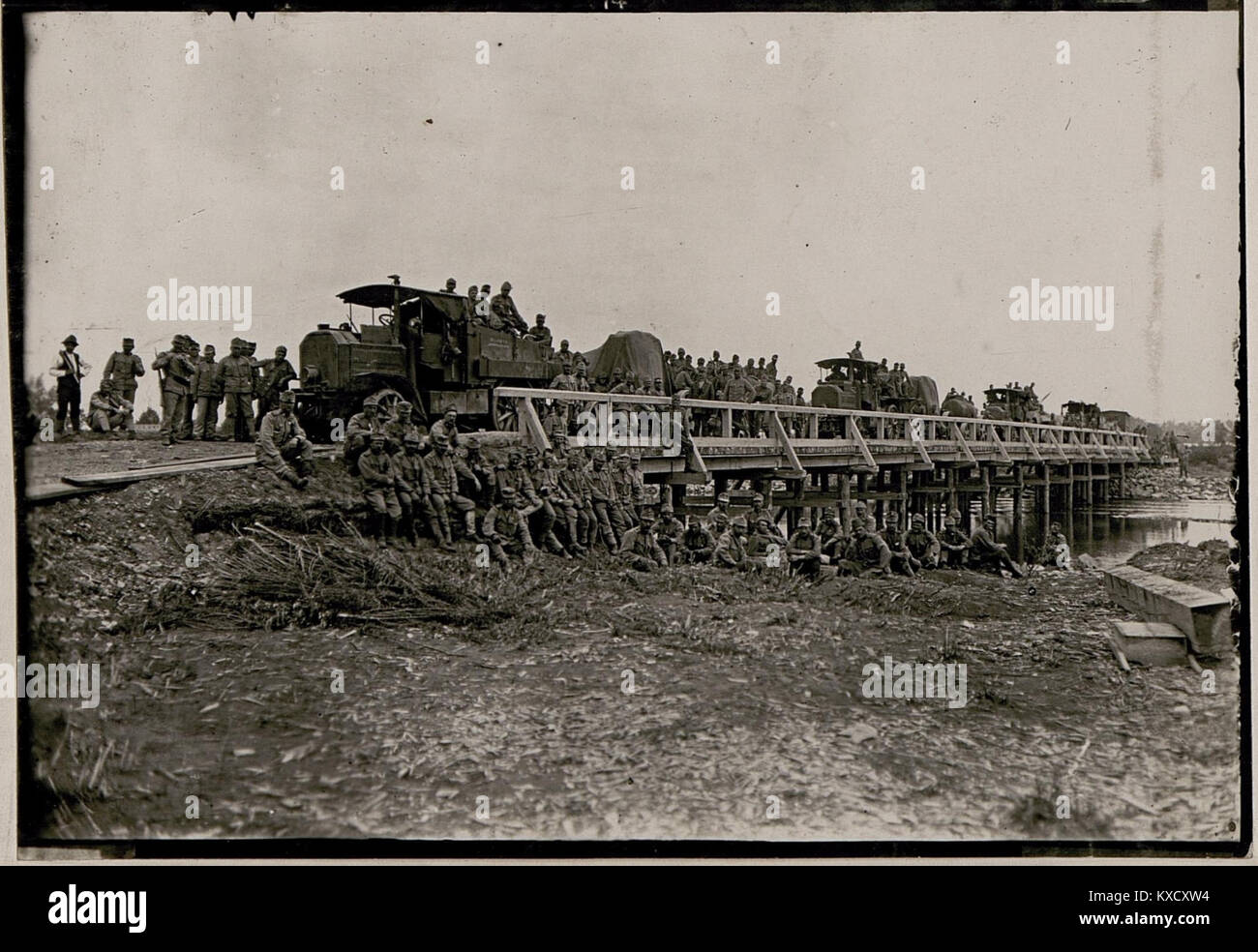 The photograph showcases a heavy artillery gun (30.5 cm) and a bridge ...