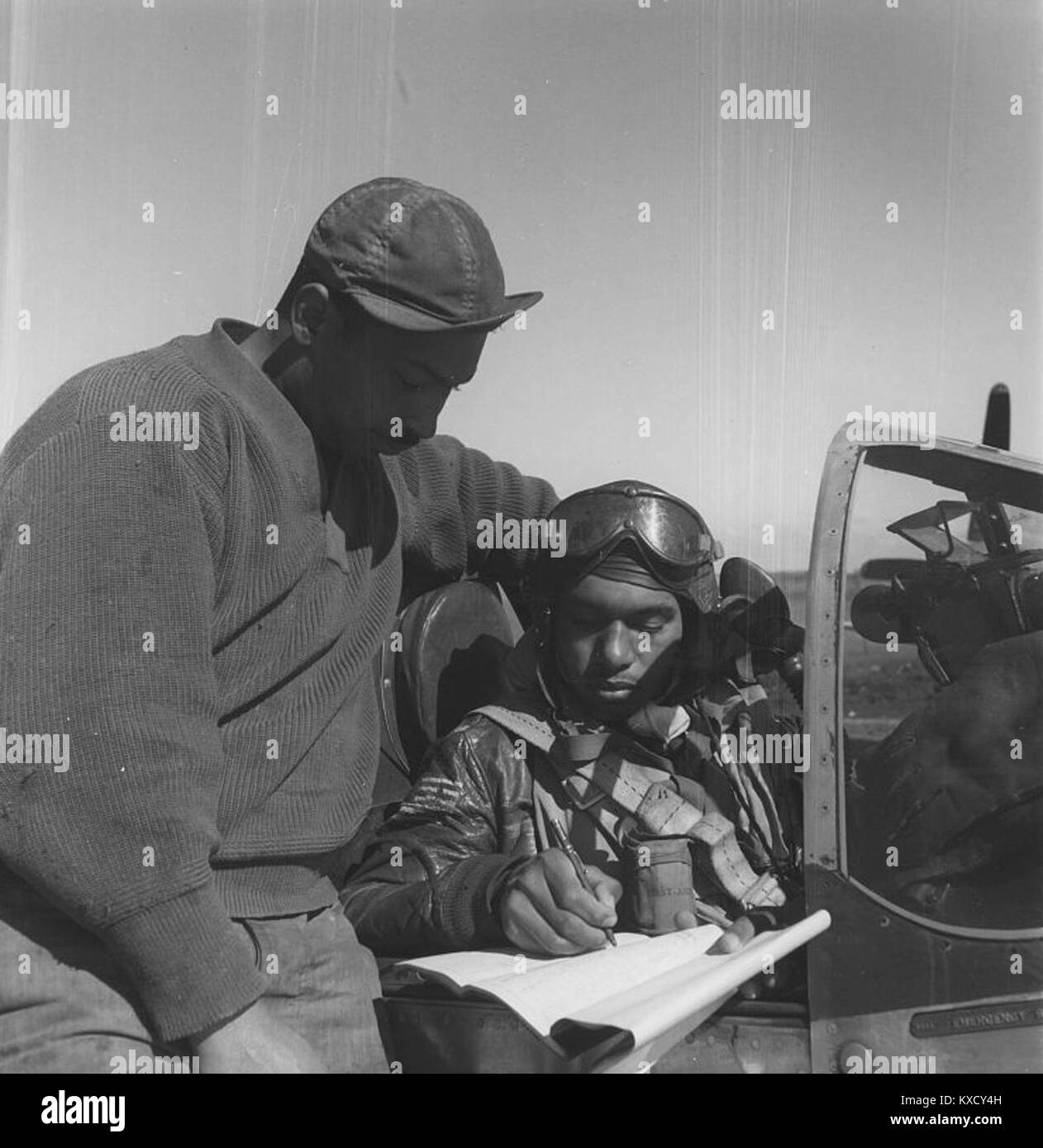 A World War II photograph showing a pilot from the 332nd Fighter Group ...